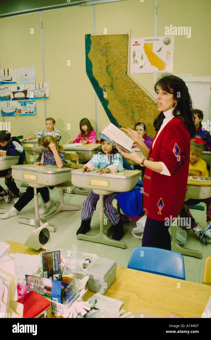 teacher reading to 4th Grade class CA Stock Photo - Alamy