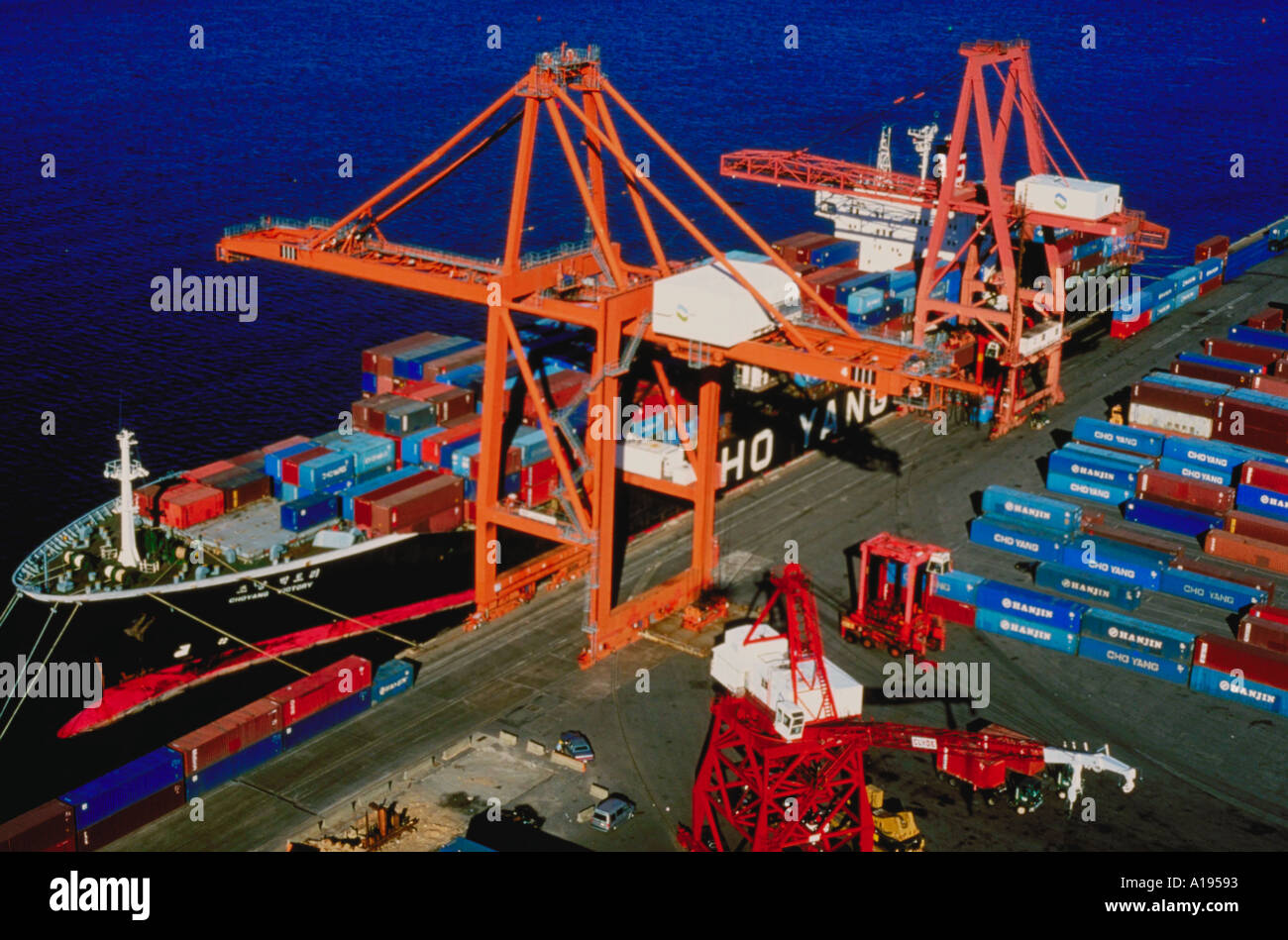Container ship being loaded Stock Photo - Alamy