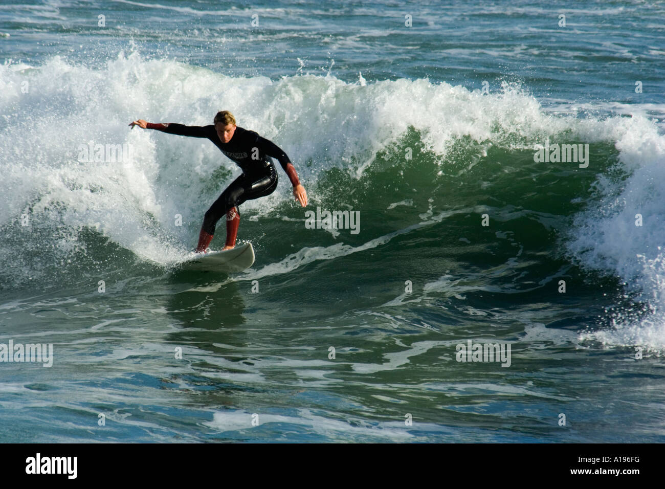 Surf Boarder riding a wave at Bournemouth, Dorset, UK Stock Photo - Alamy