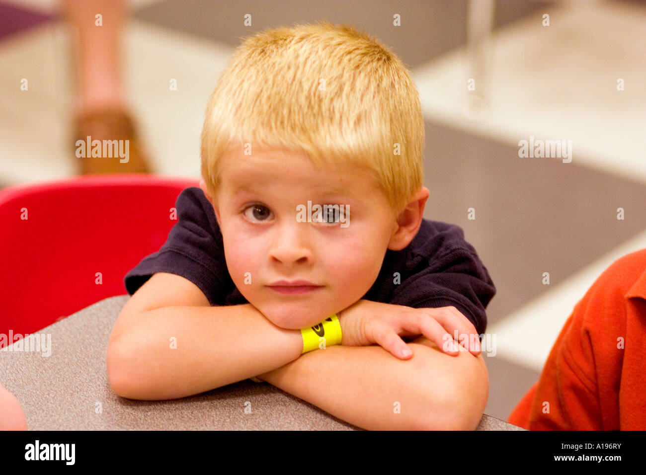 Boy age four deep in thought in Science Museum classroom. St Paul ...