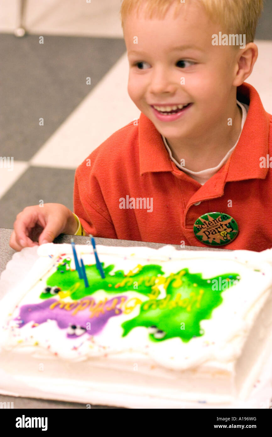 Boy age 5 enjoying ghost decorated birthday cake. St Paul Minnesota MN ...