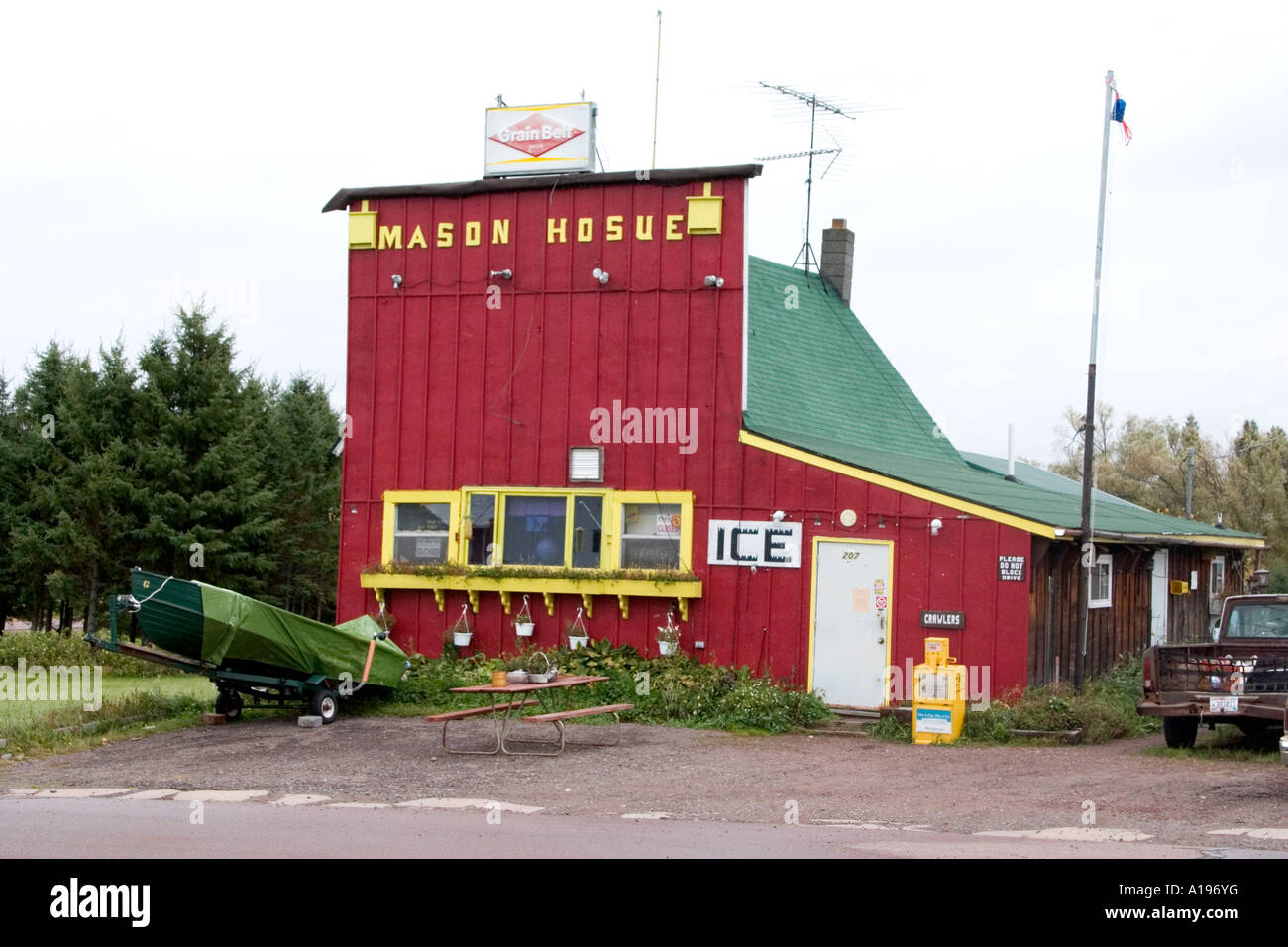 Boat parked at quaint Mason Hosue bar and restaurant. Mason Wisconsin ...