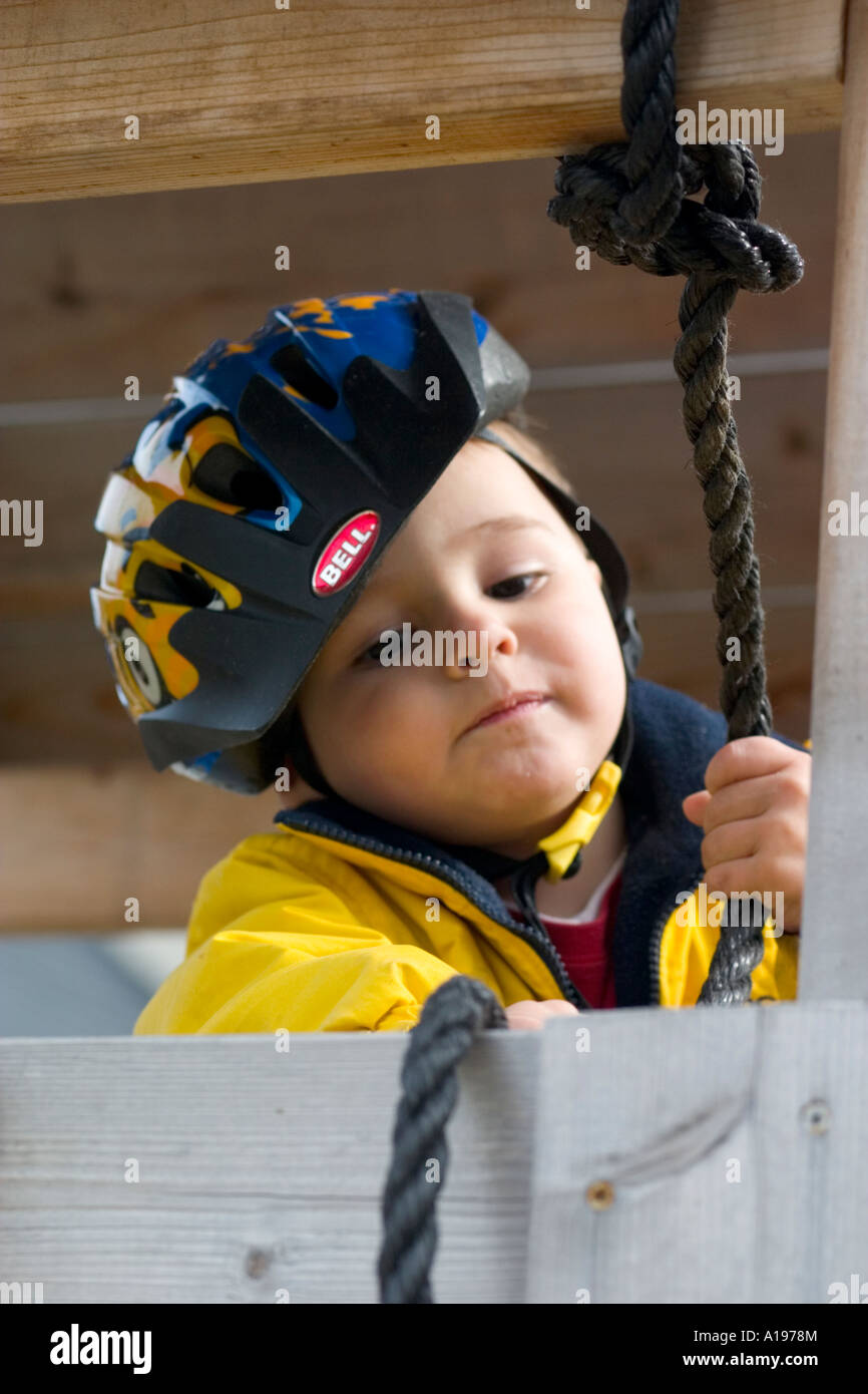 Toddler pulling rope in elevated play house. St Paul Minnesota USA ...