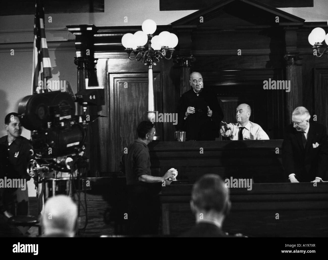 JUDGEMENT AT NUREMBERG Stanley Kramer in shirtsleeves directing scene ...