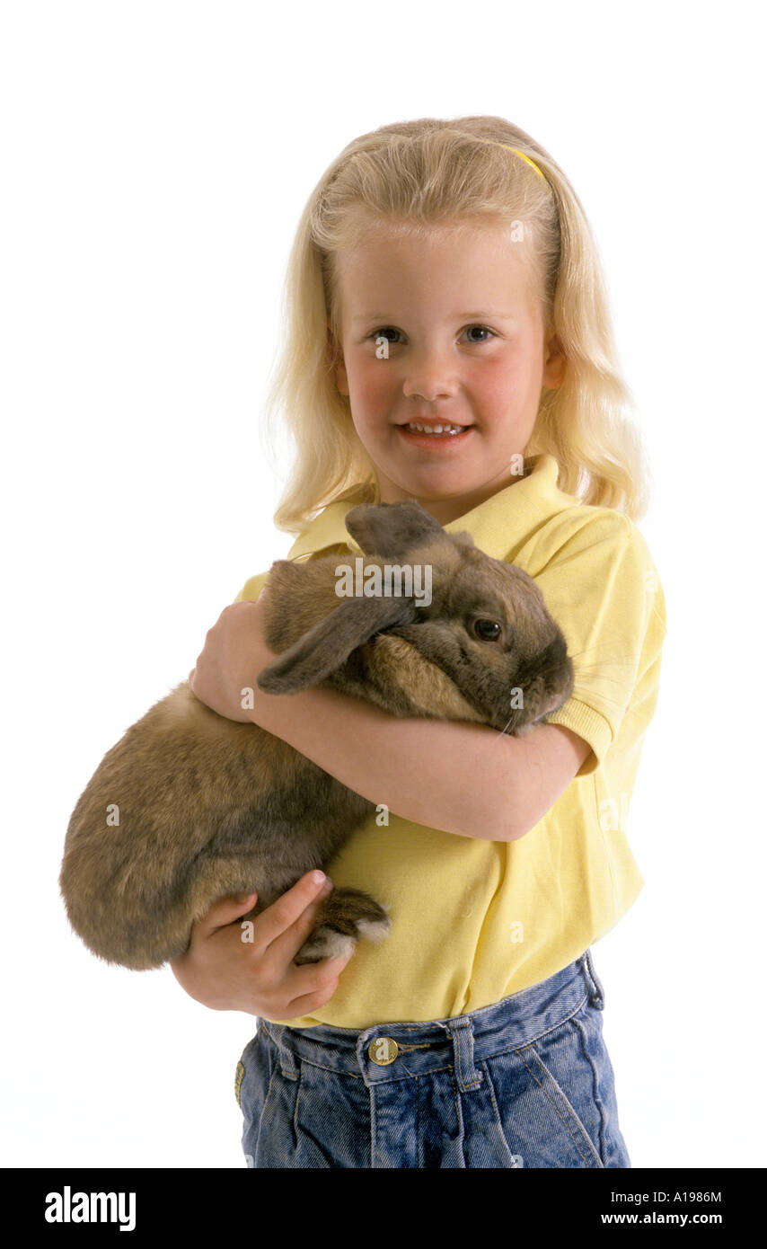 Blond girl with a rabbit in her arms Stock Photo - Alamy