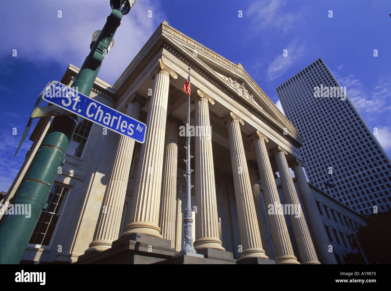 Street sign and colonnaded building on St Charles Avenue in the French ...
