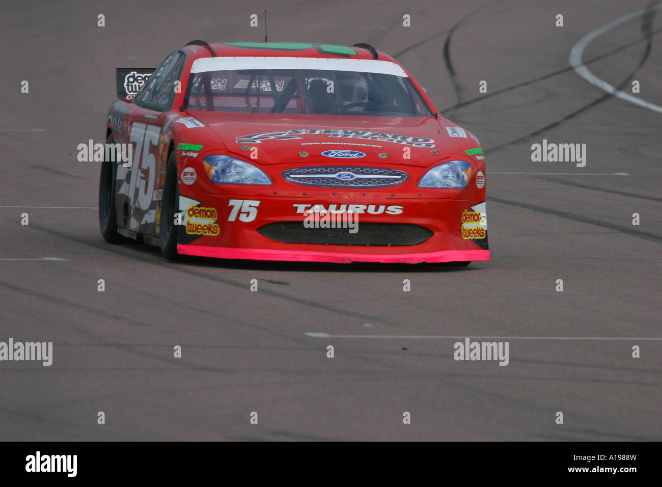 V8 Nascar type stock cars racing on a banked oval circuit Stock Photo ...