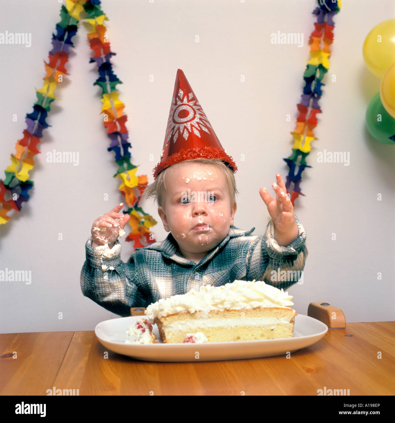 One year old eating his birthday cake Stock Photo - Alamy