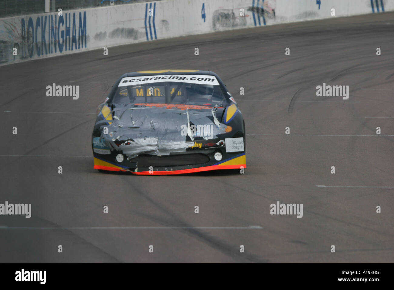 V8 Nascar type stock cars racing on a banked oval circuit Stock Photo ...