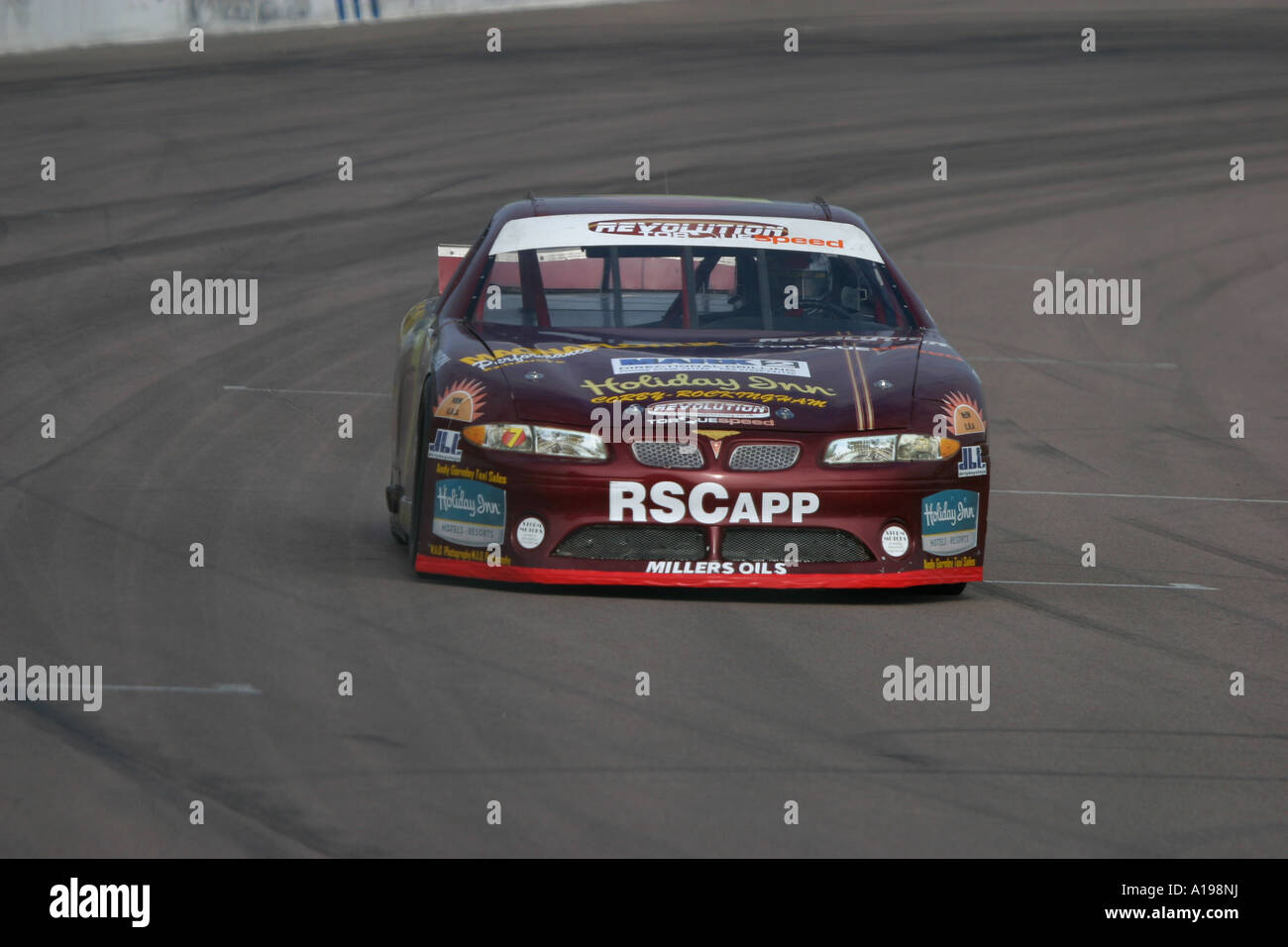 V8 Nascar type stock cars racing on a banked oval circuit Stock Photo ...