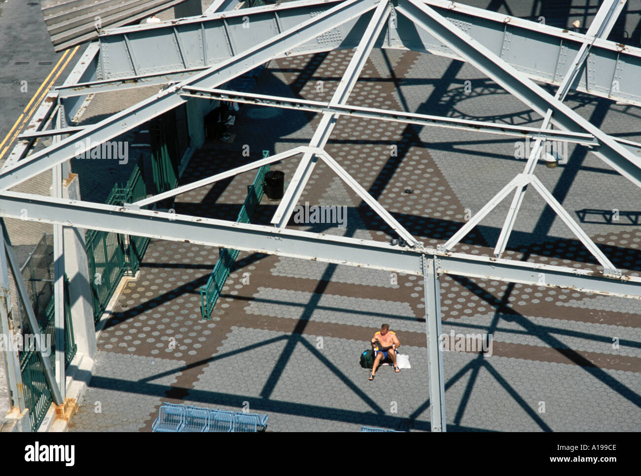 Man sunbathing on roof hi-res stock photography and images - Alamy