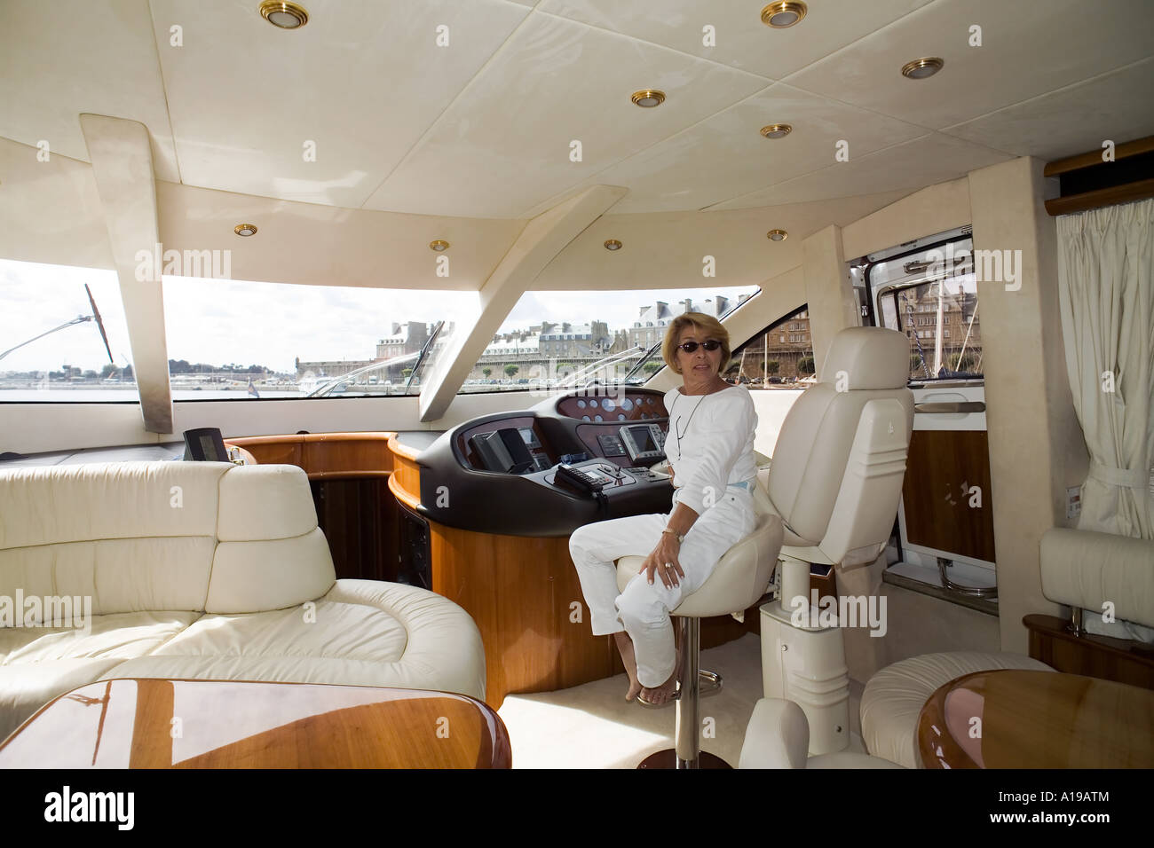 Woman sitting inside a private luxury yacht France Europe Stock Photo ...