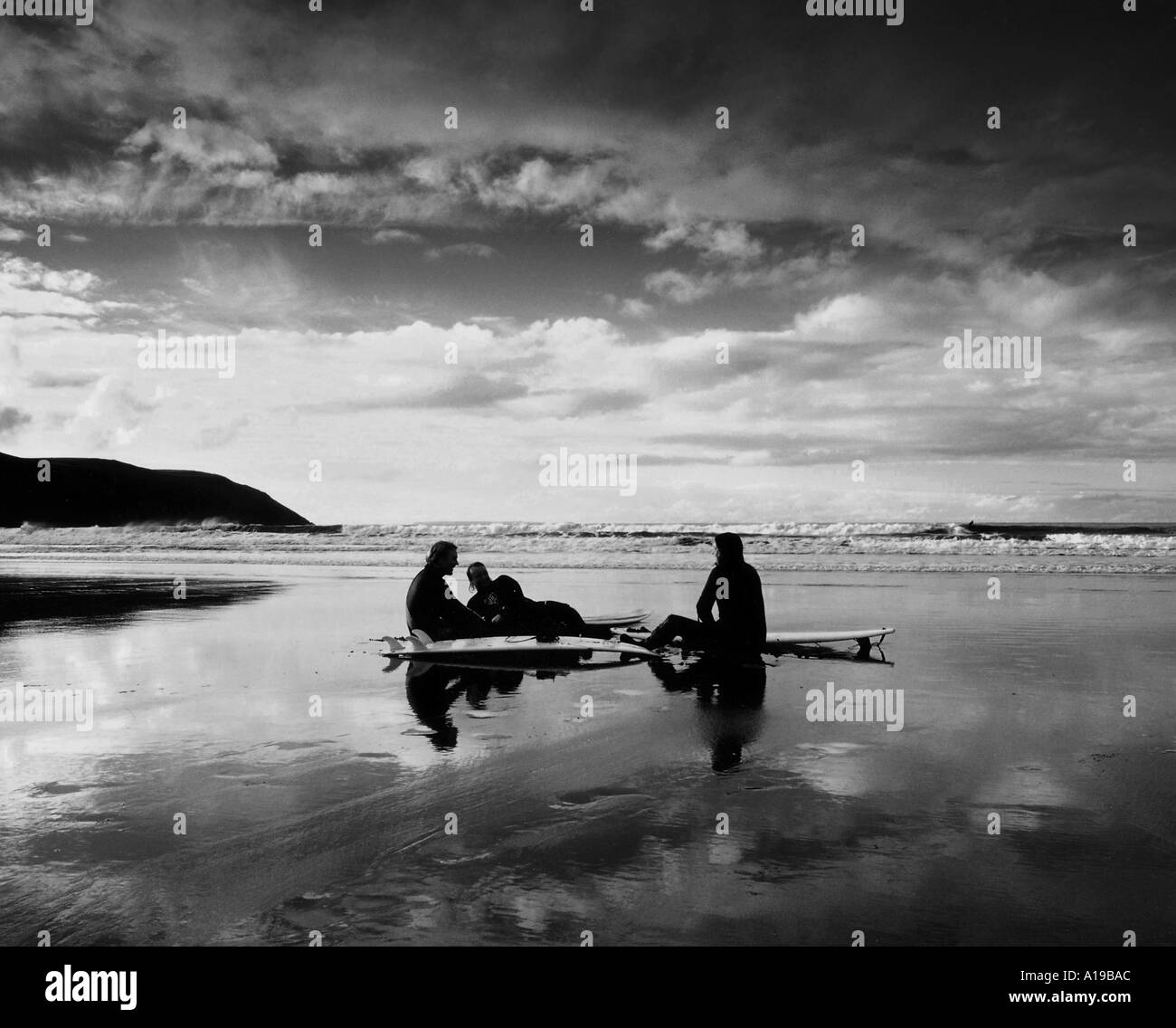 Surfers chatting beach hi-res stock photography and images - Alamy