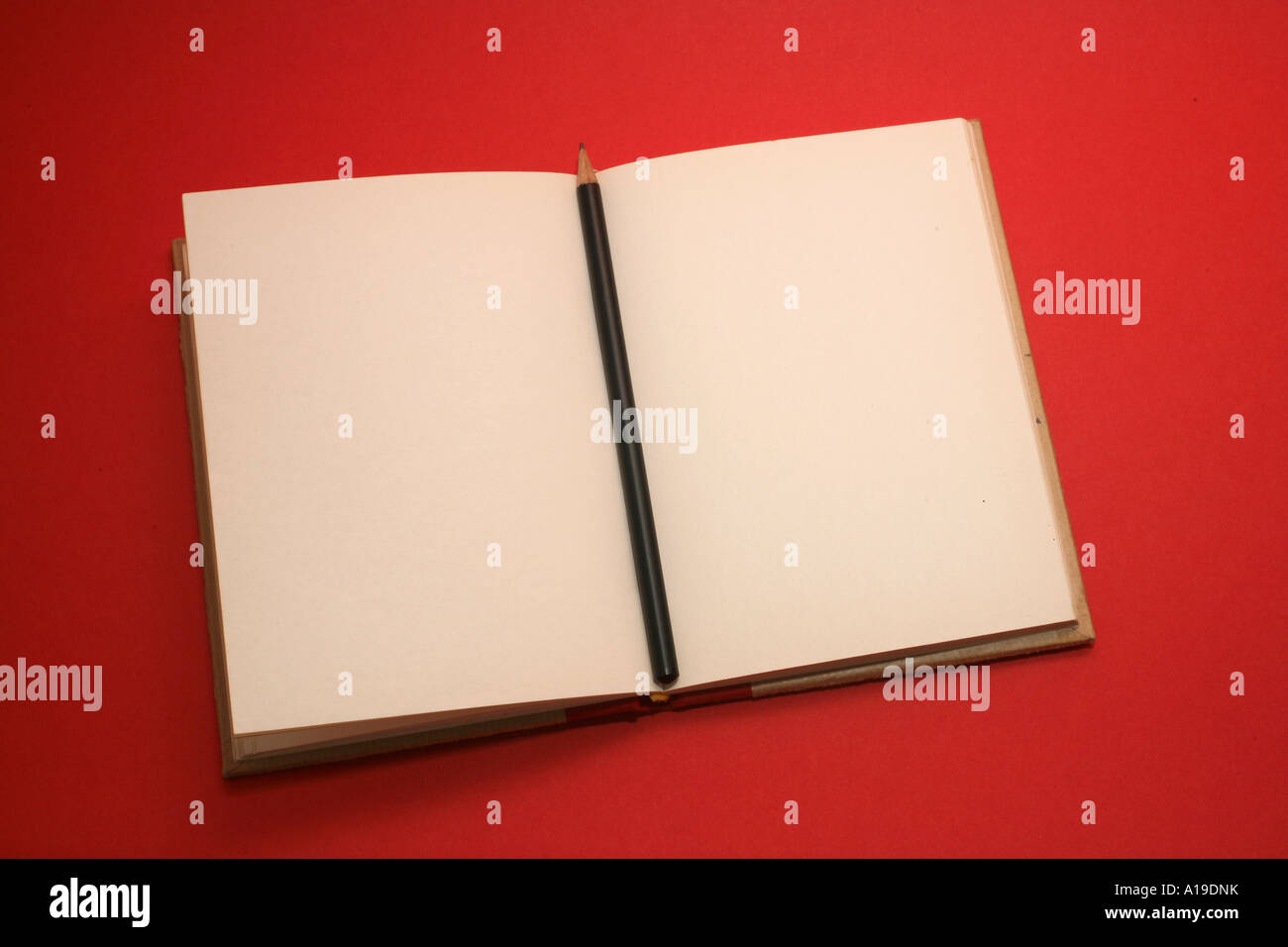 An open notebook with pencil Stock Photo - Alamy