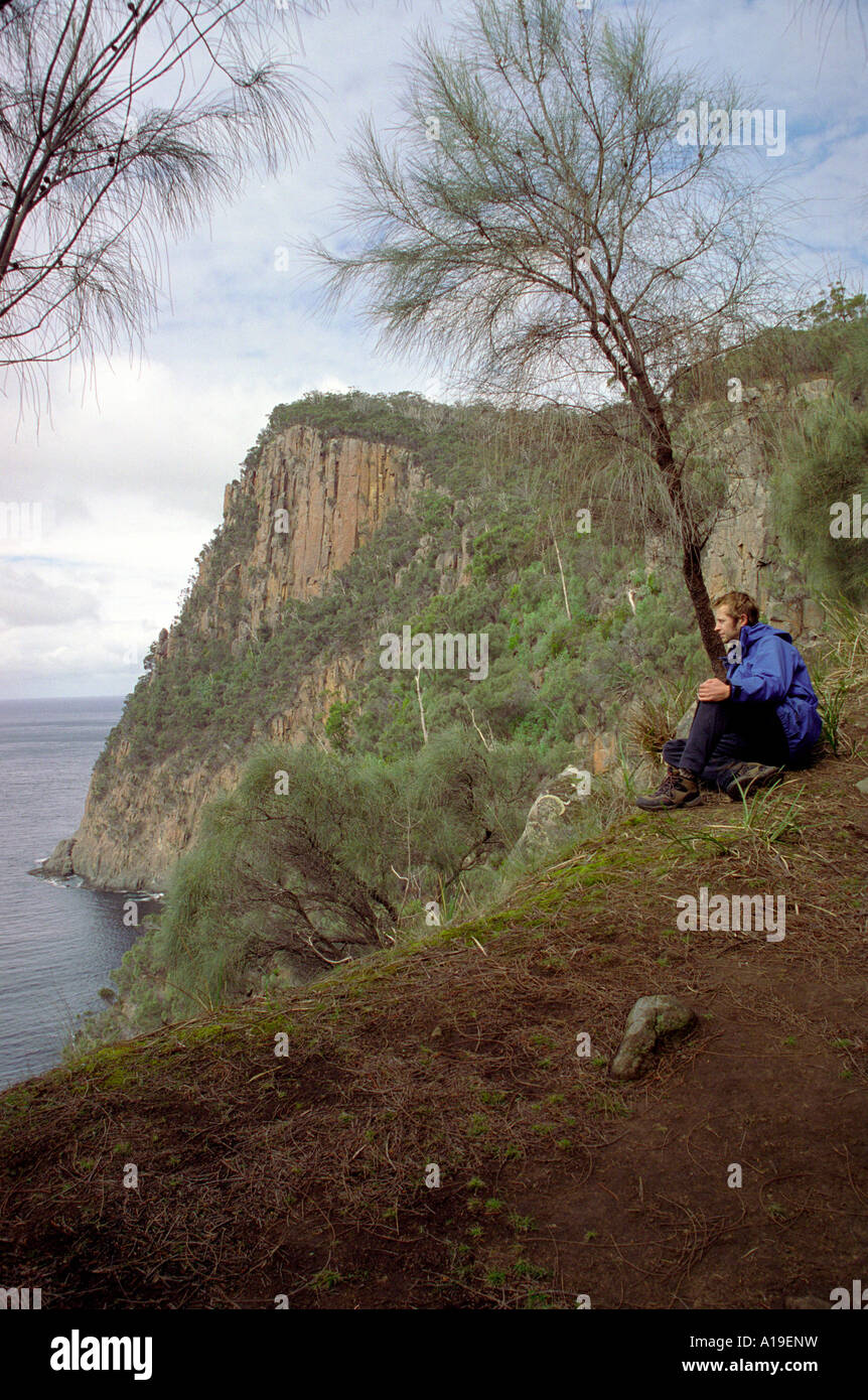Walker sat at top of huge cliffs at Fluted Cape near Adventure Bay ...