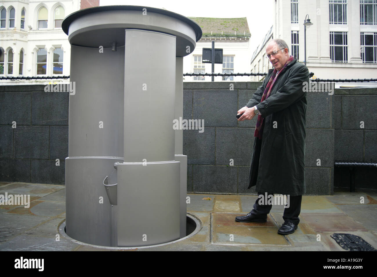 A councillor activates the Urilift public lavatory using a remote ...