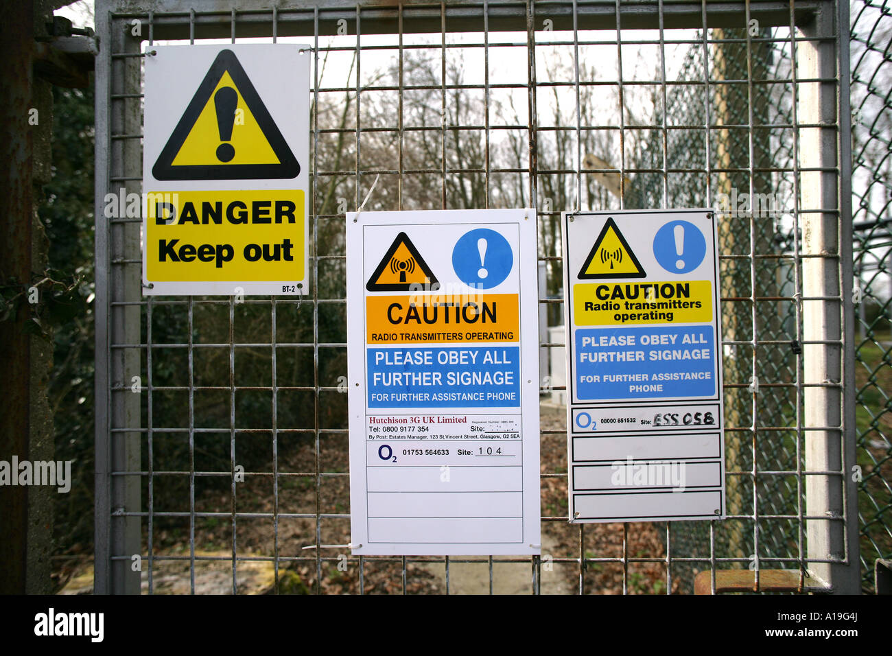 Warning notices on the perimeter fence of a British Telecom (BT ...