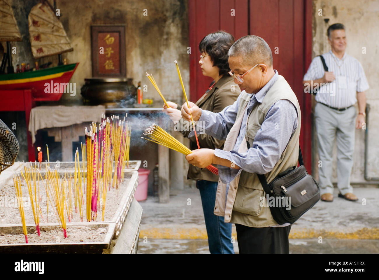 Chinese ethnic woman praying hi-res stock photography and images - Alamy