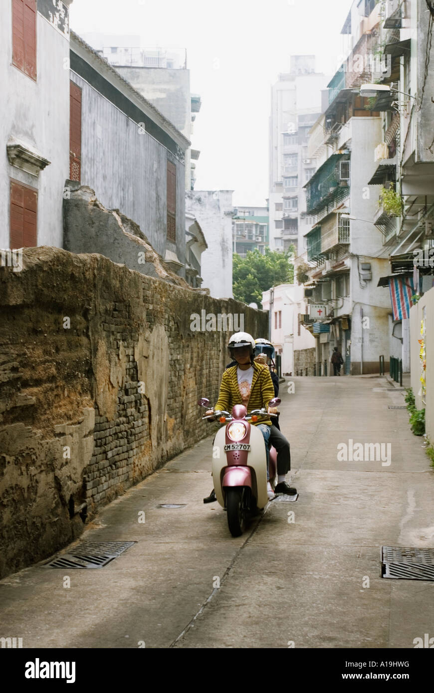 Macau Girl Driving Scooter China Stock Photo - Alamy