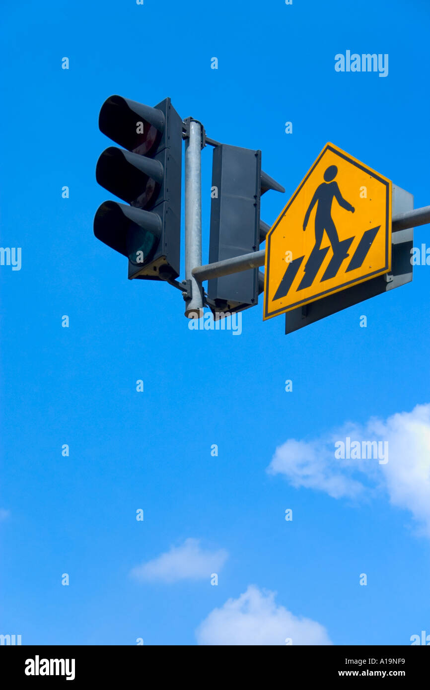 zebra crossing signboard and traffic lights against blue sky Stock ...