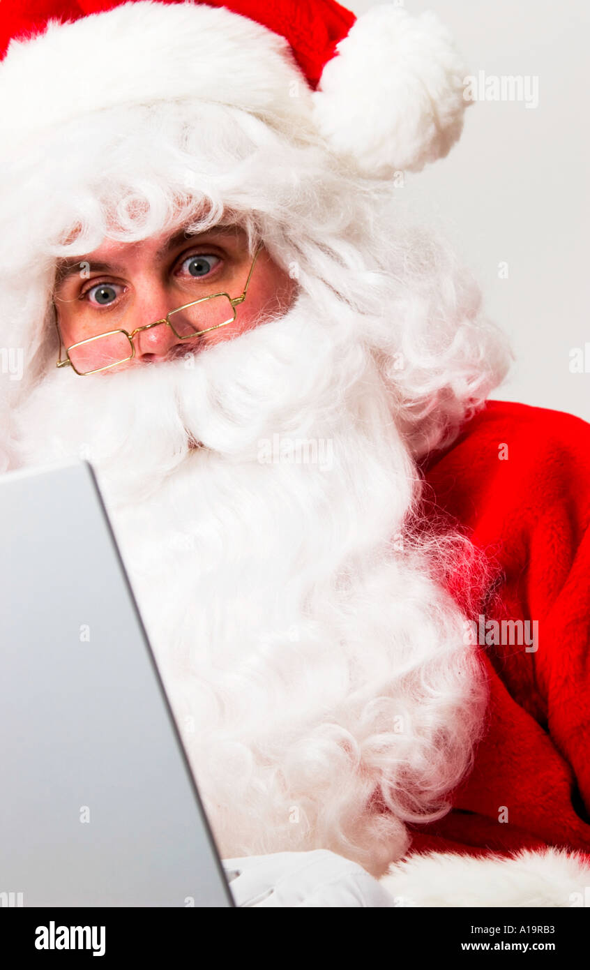 Santa with laptop Stock Photo - Alamy