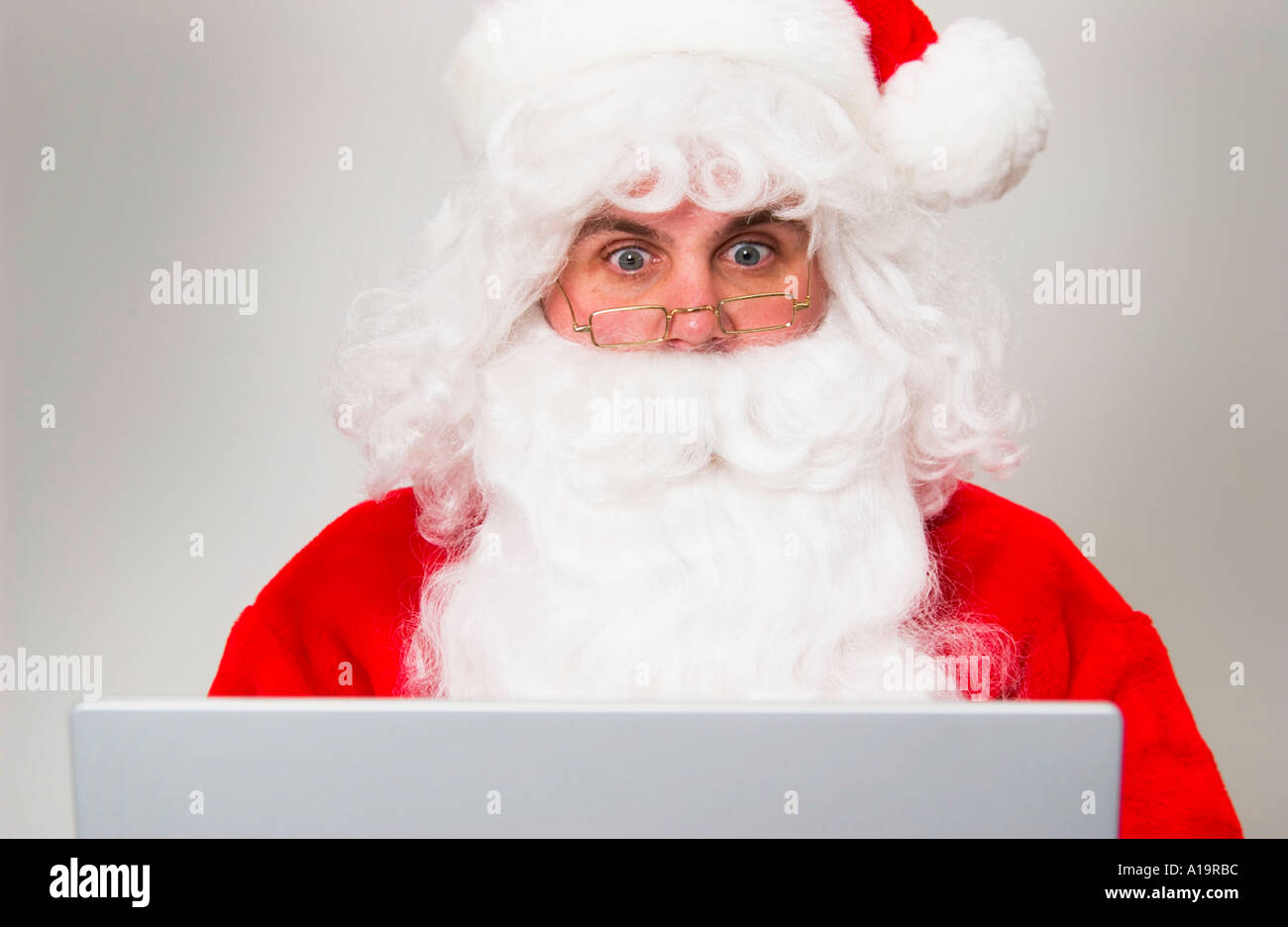 Santa claus laptop checking hi-res stock photography and images - Alamy