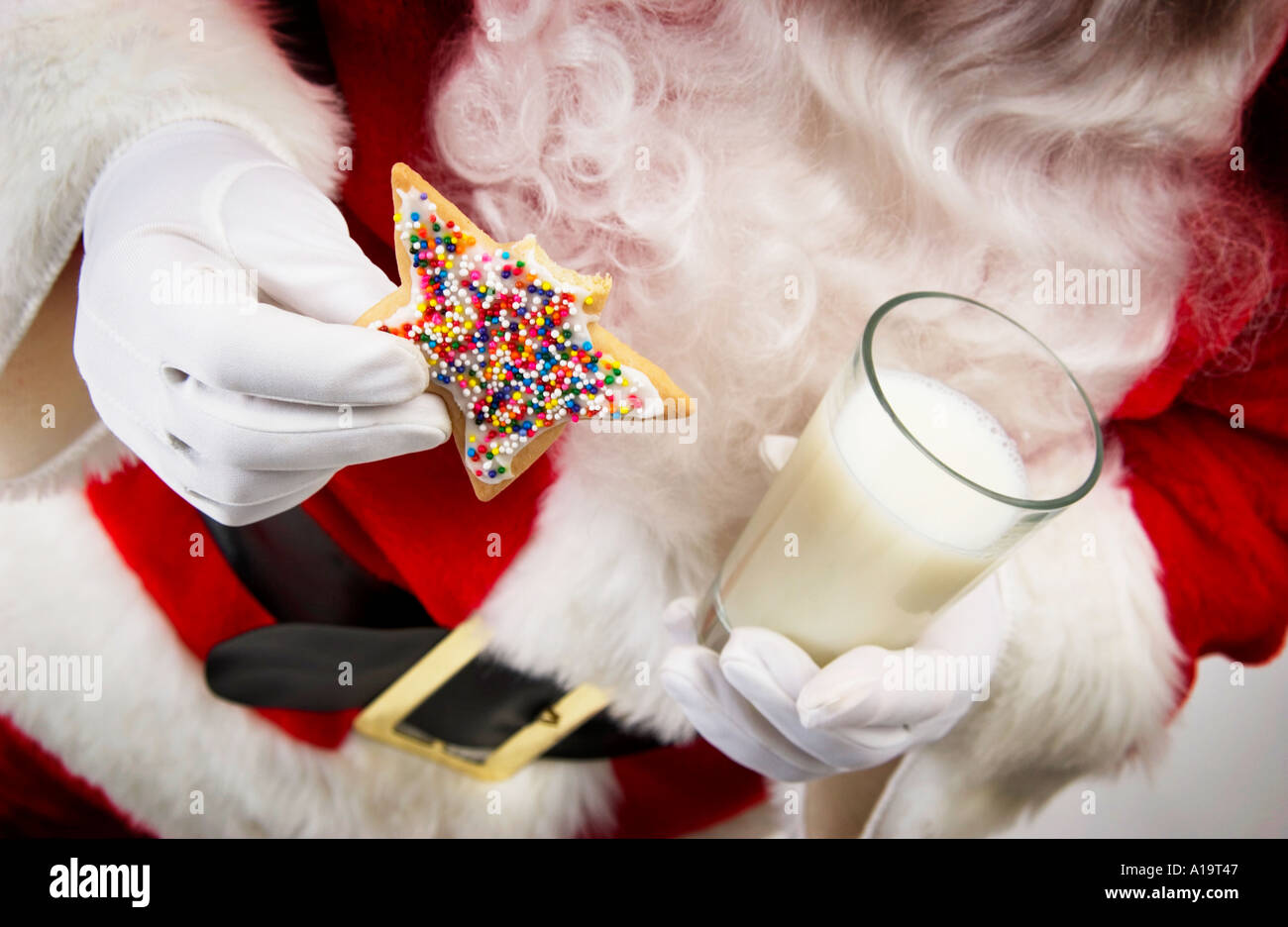 Santa with cookie and milk Stock Photo - Alamy