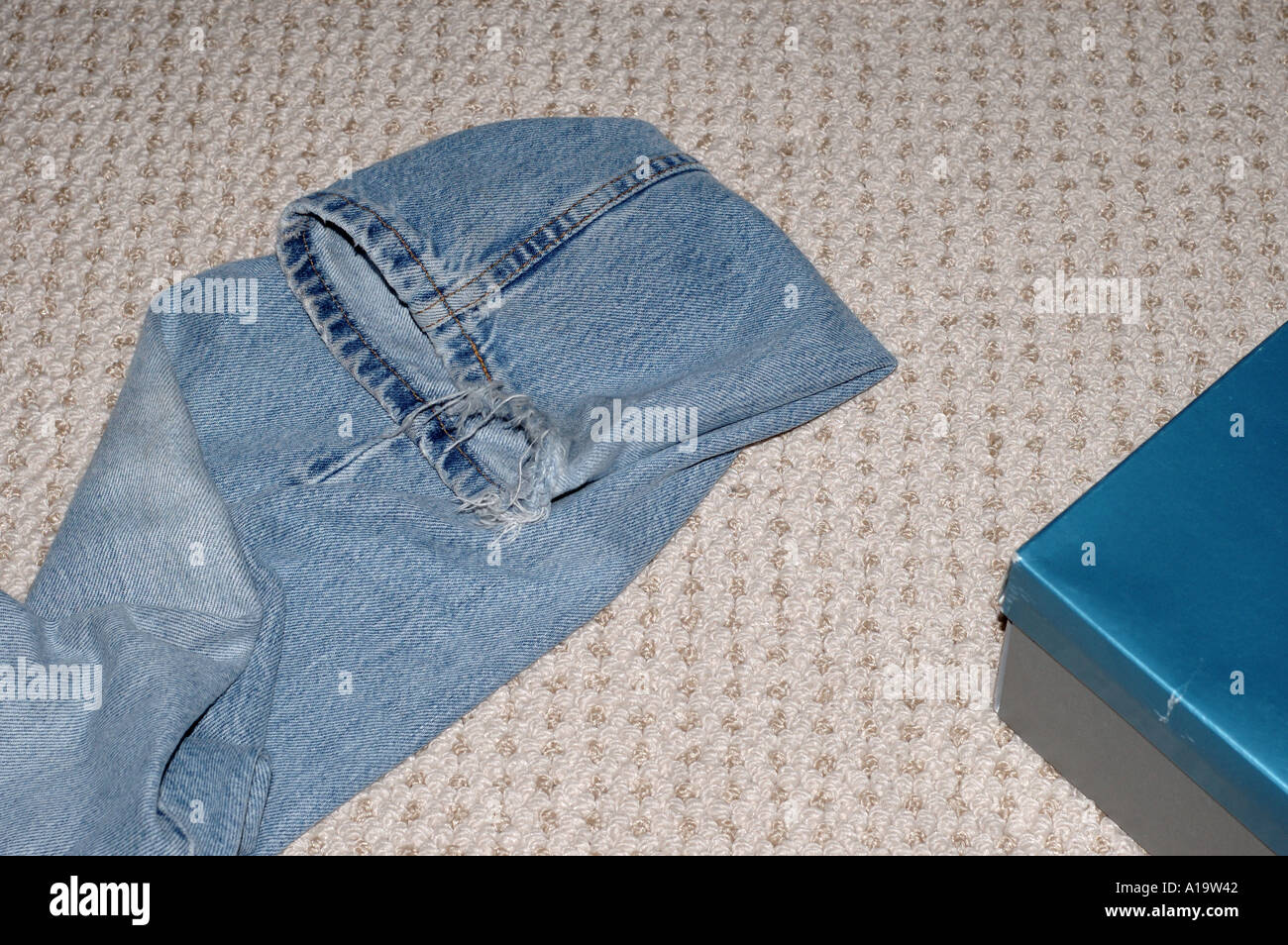 Folded denim on floor hi-res stock photography and images - Alamy