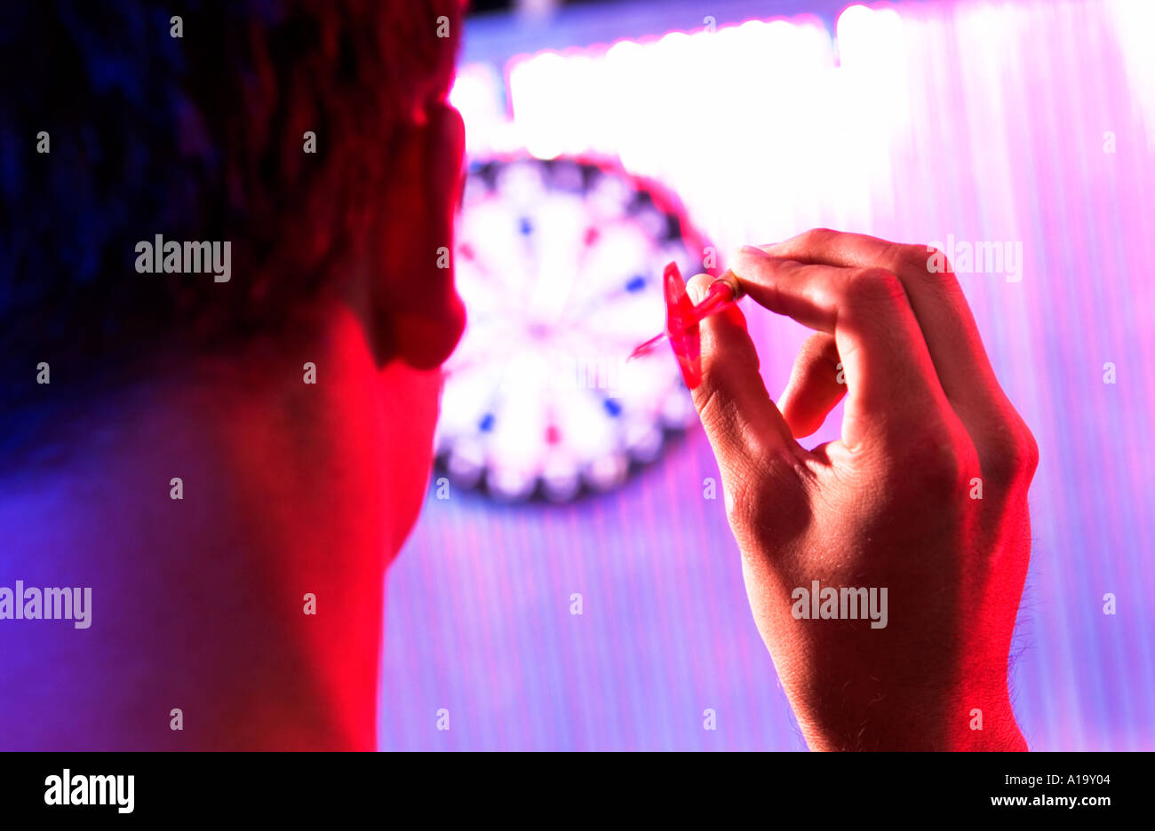 Man playing darts Stock Photo - Alamy