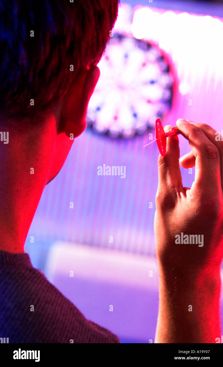 Man playing darts Stock Photo - Alamy