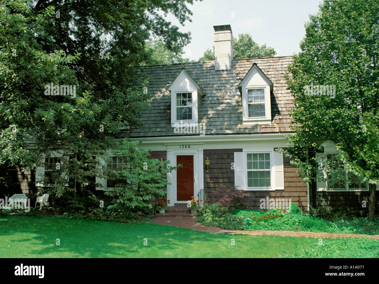 Cape Cod Style house of wood shakes and path in Summer four seasons ...