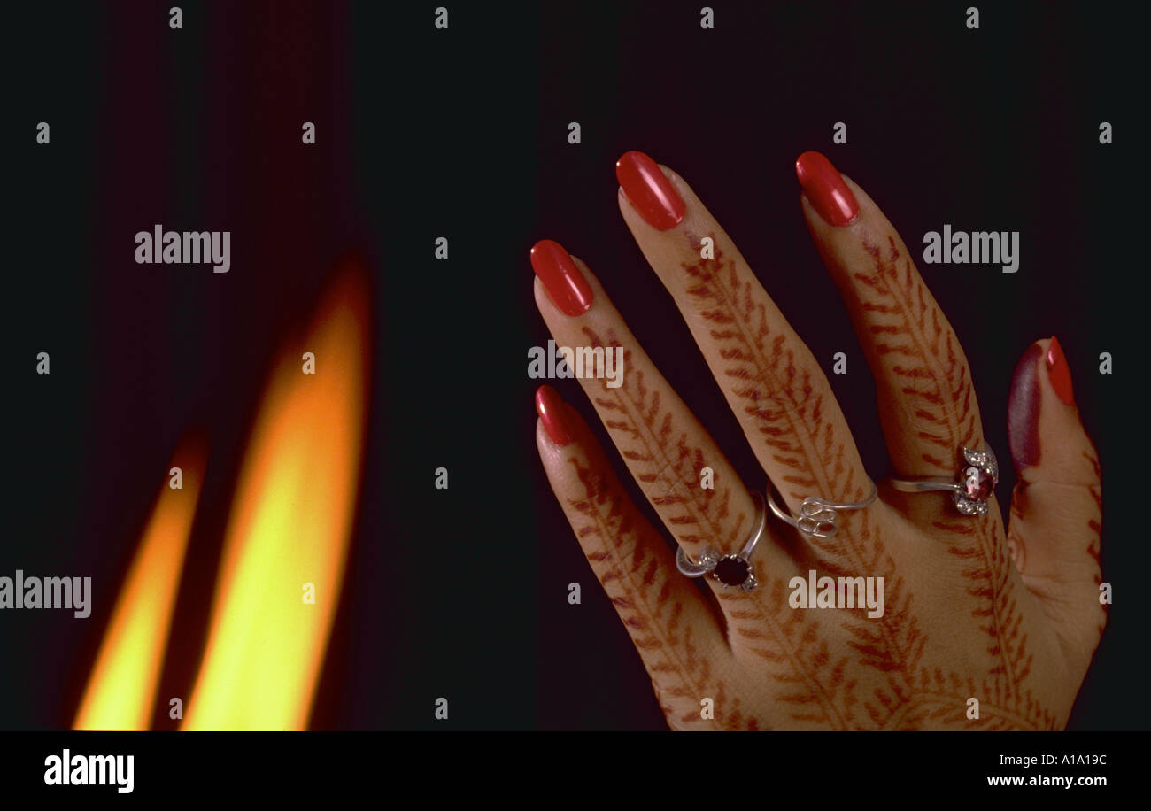 Woman's hand with henna tattoos Stock Photo - Alamy