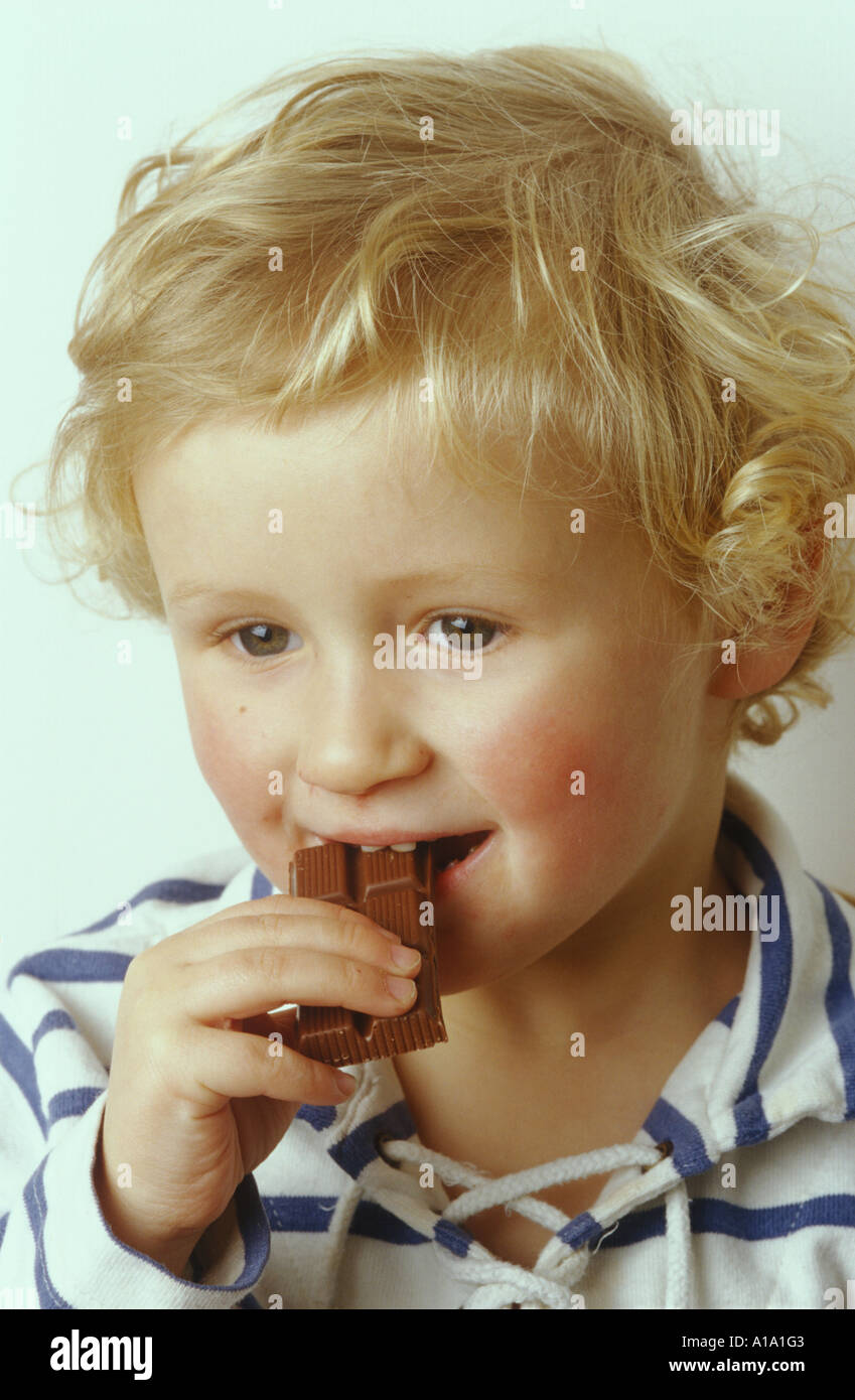 little boy eating chocolate Stock Photo - Alamy