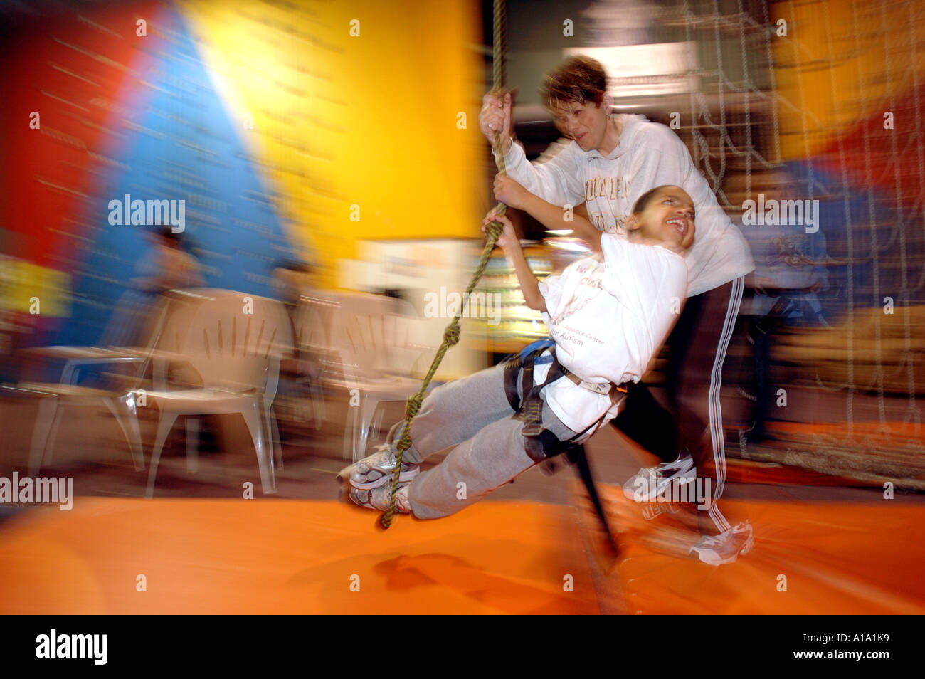 Child pushed on swing hi-res stock photography and images - Alamy
