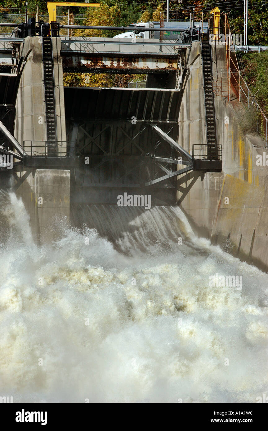 Water flows out of a man made dam Stock Photo - Alamy