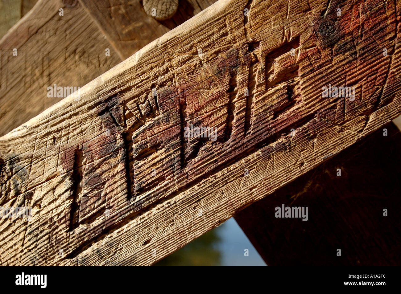 The name Lewis is carved into the side of a building Stock Photo - Alamy