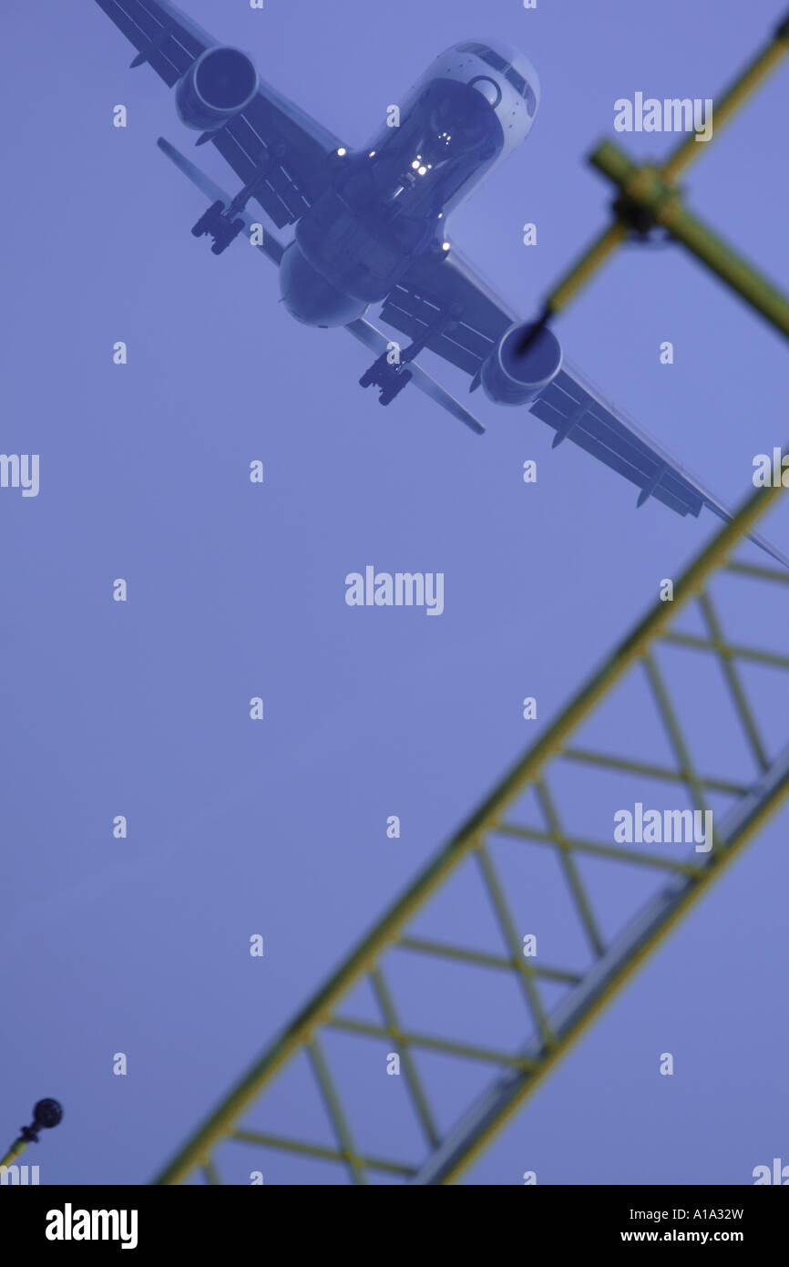 Jet airline airliner on final approach to land over runway approach ...