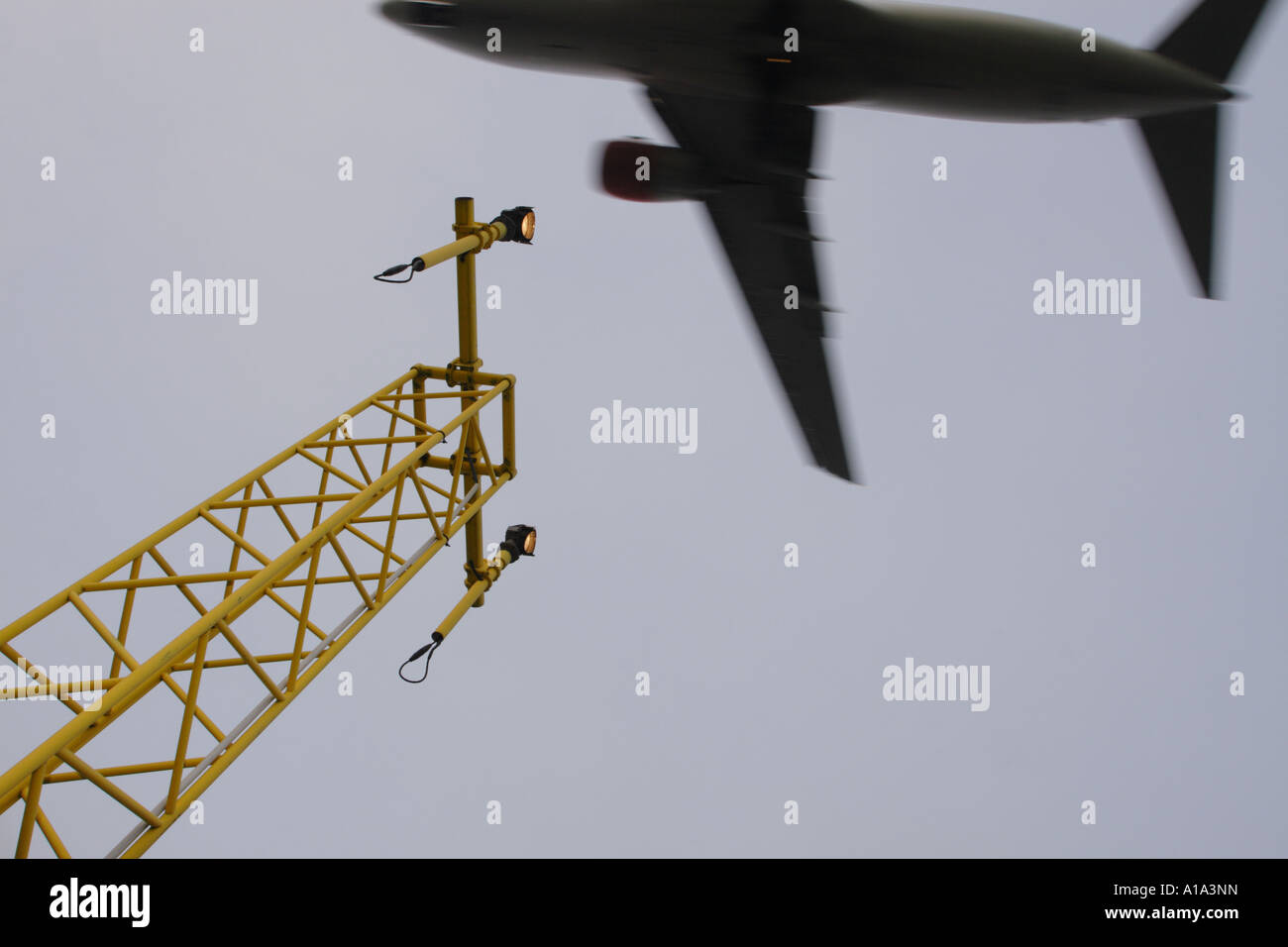 Airport landing lights with commercial passenger jet plane airliner ...