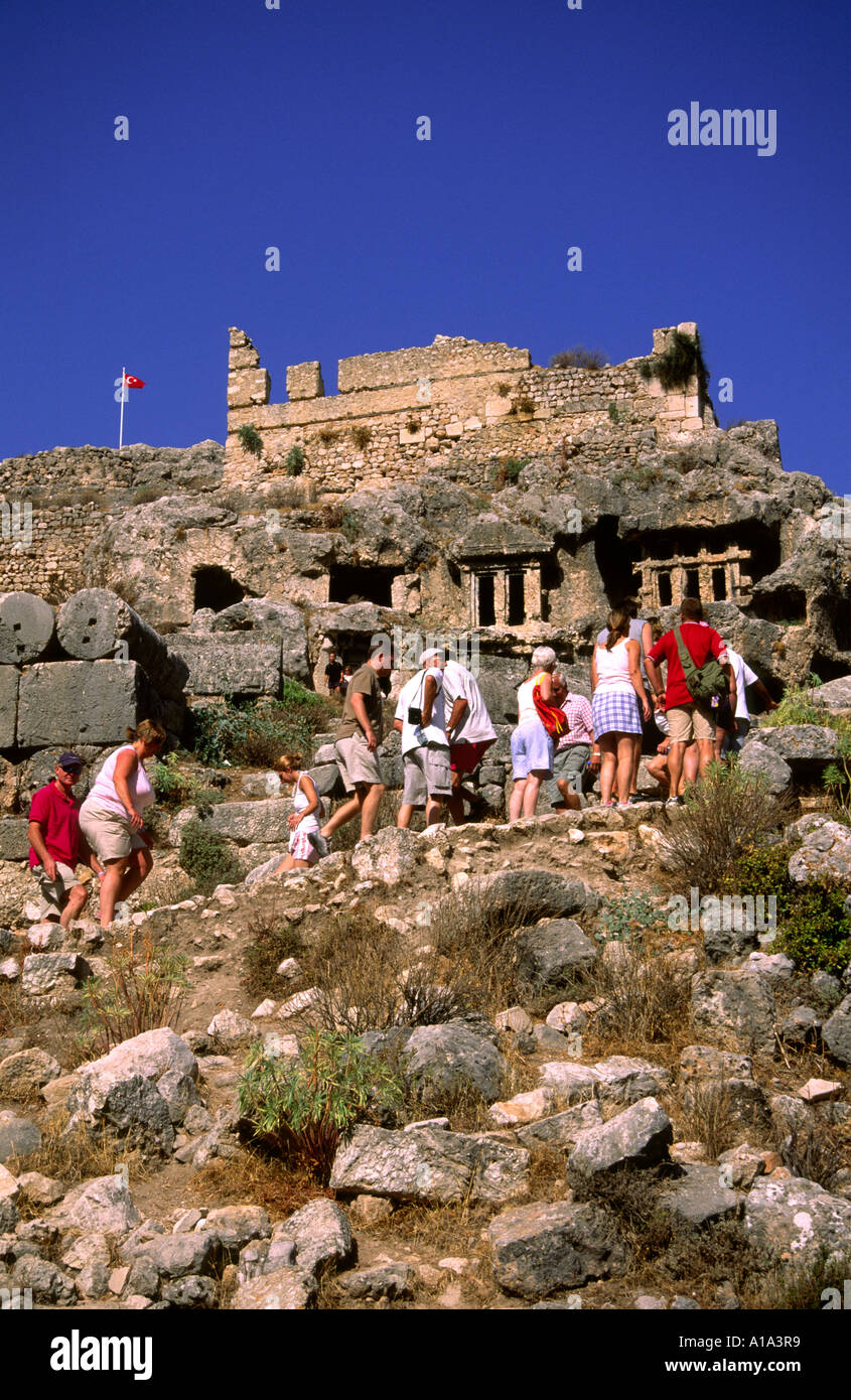Carved Lycian tombs at the ancient city of Tlos with the castle of ...