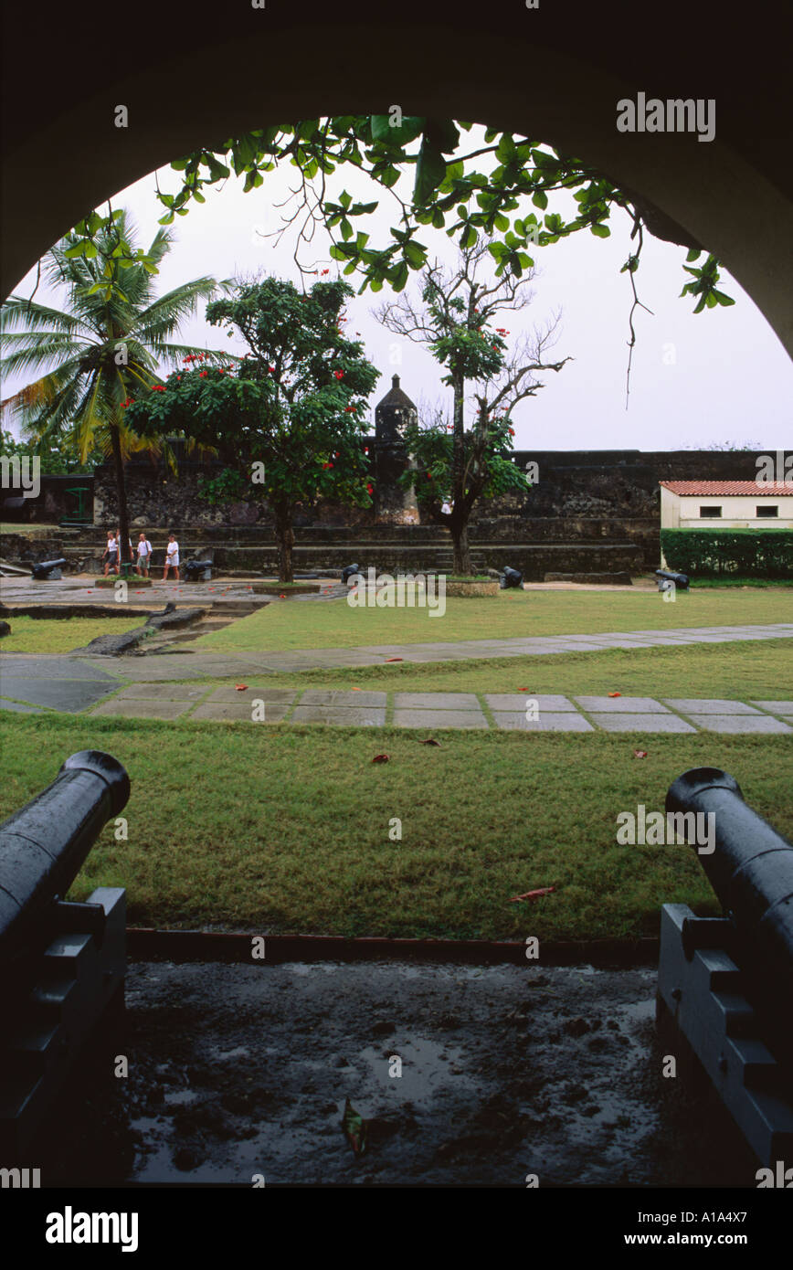 Looking out of an arch with 2 small canons inside Fort Jesus, Mombasa ...