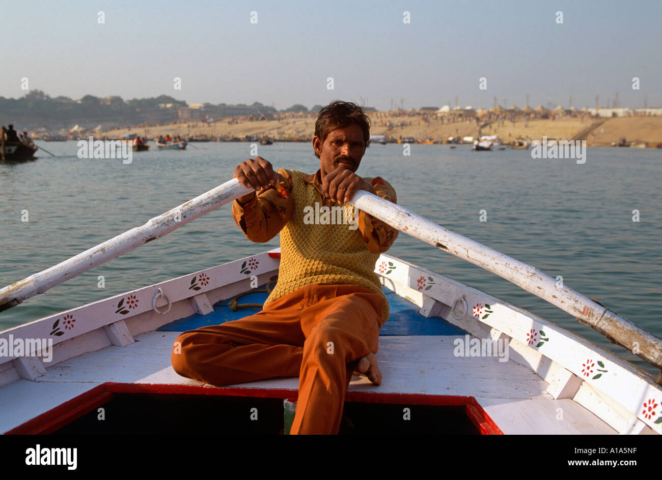 Indian man boatman rowing boat hi-res stock photography and images - Alamy