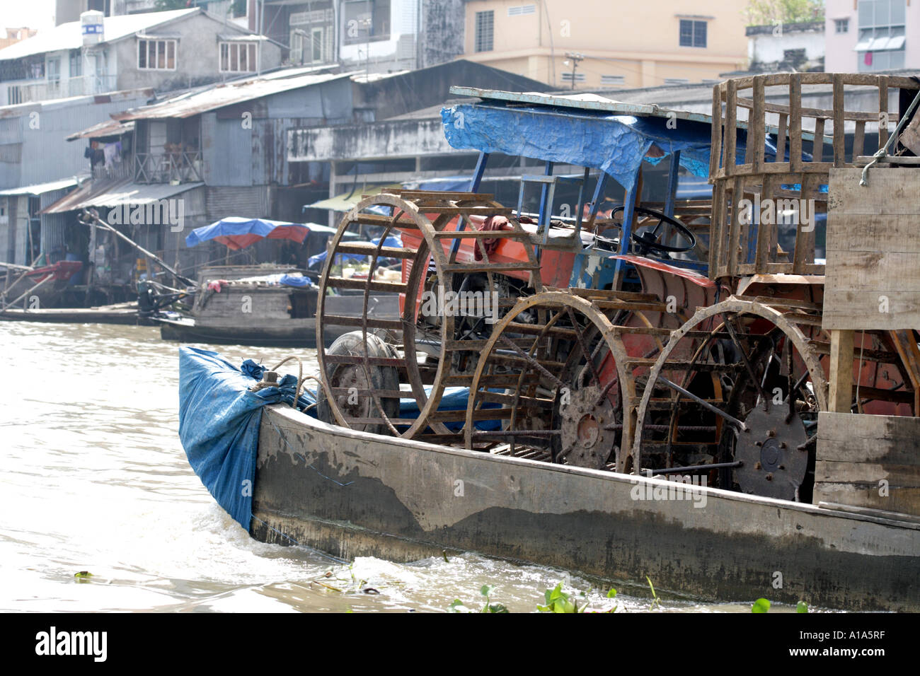 Barge hauls farming equipment on the Mekong Delta, Vietnam Stock Photo ...
