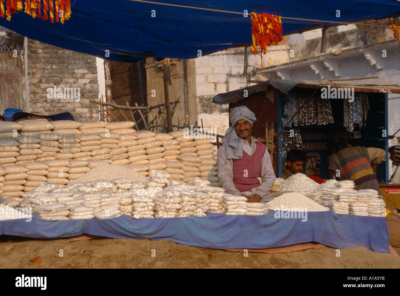 Stall selling bags of prasad for religious offerings, Maha Kumbh Mela ...
