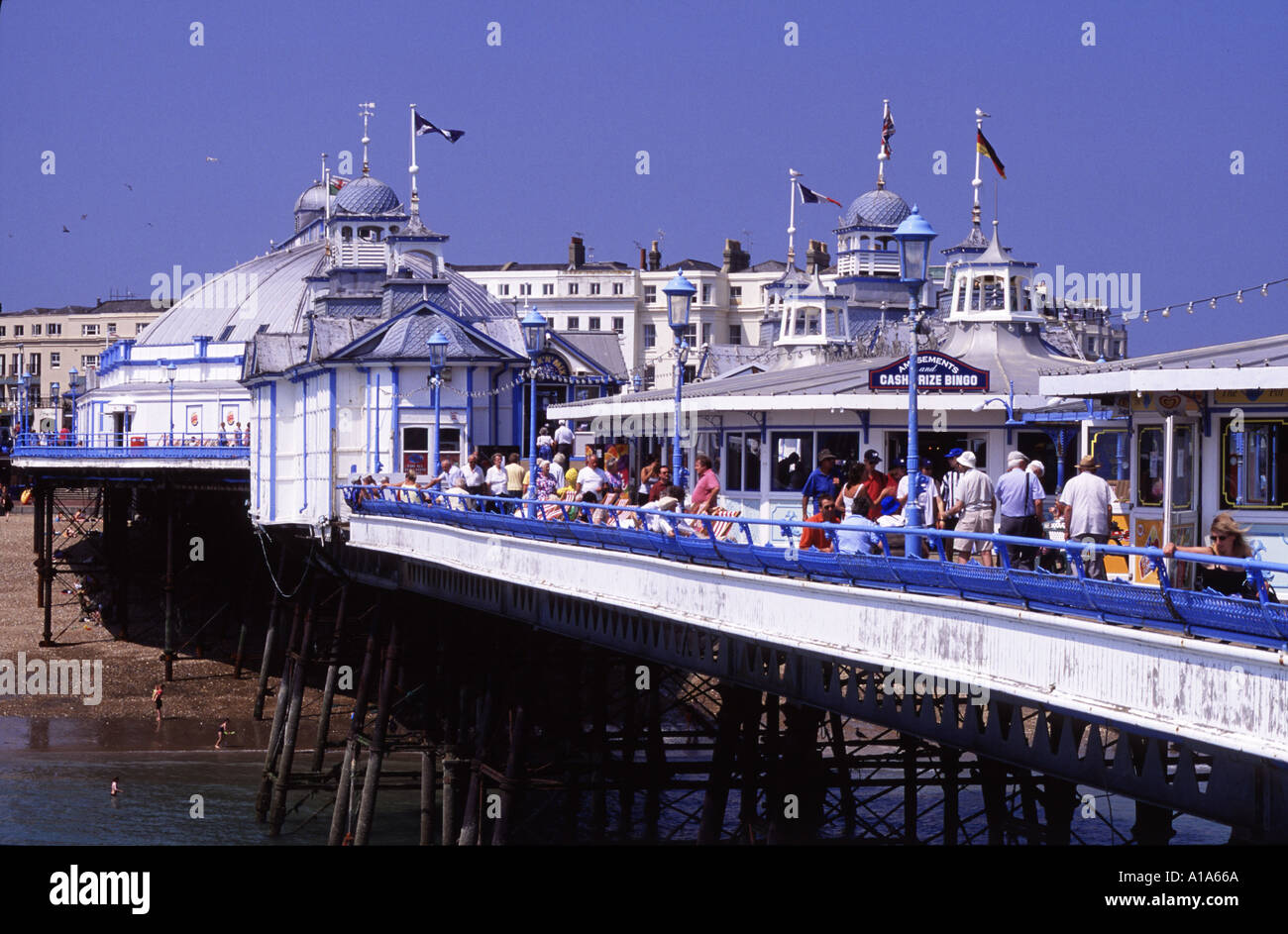 Pier at Eastbourne busy with tourists at the height of Summer Sussex UK ...
