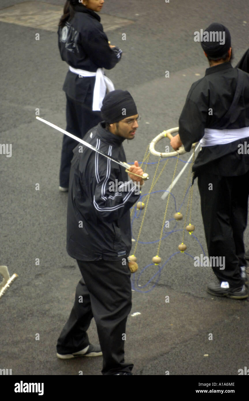 Sikh men swords hi-res stock photography and images - Alamy