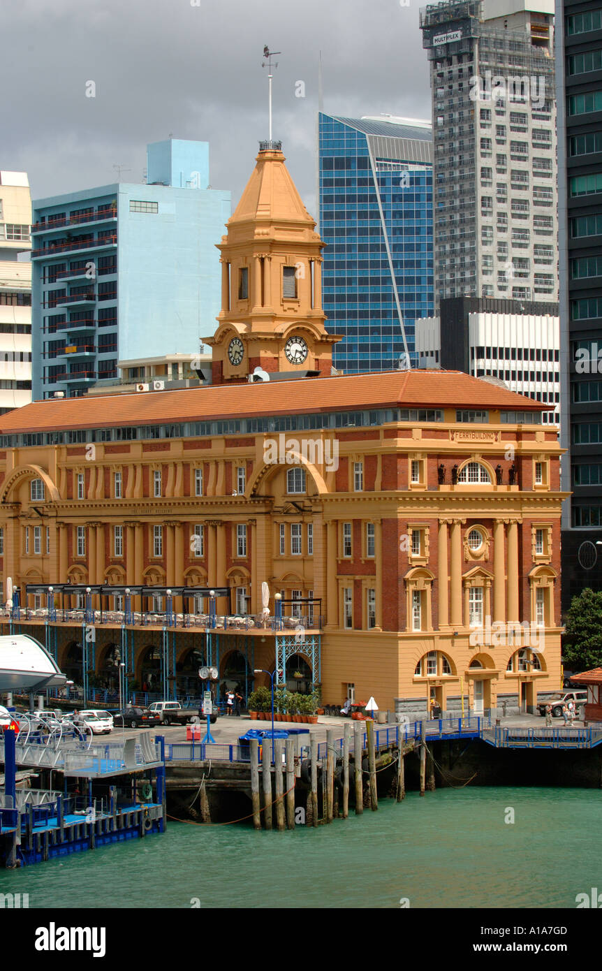 The sandstone and brick Auckland Ferry building and HSBC office tower ...
