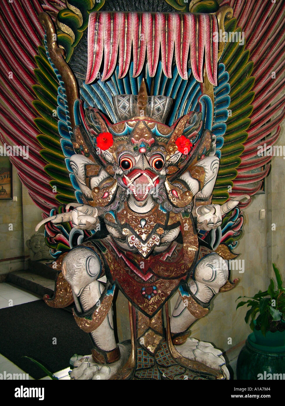 Iconic wood carving of Garuda, the mythical bird in hotel foyer, Ubud ...