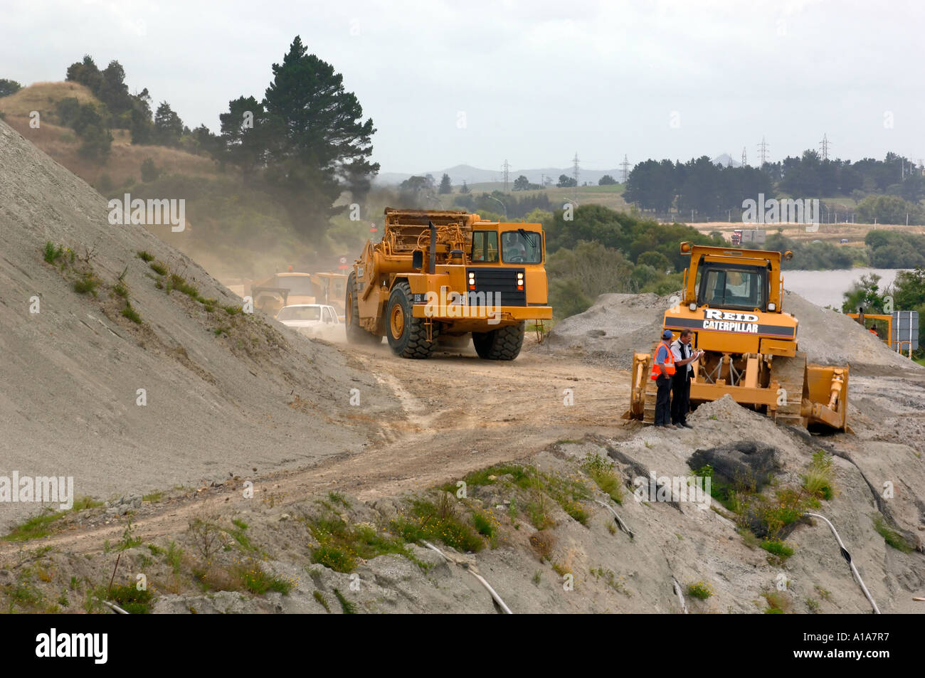 Heavy construction equipment on site during construction of motorway ...