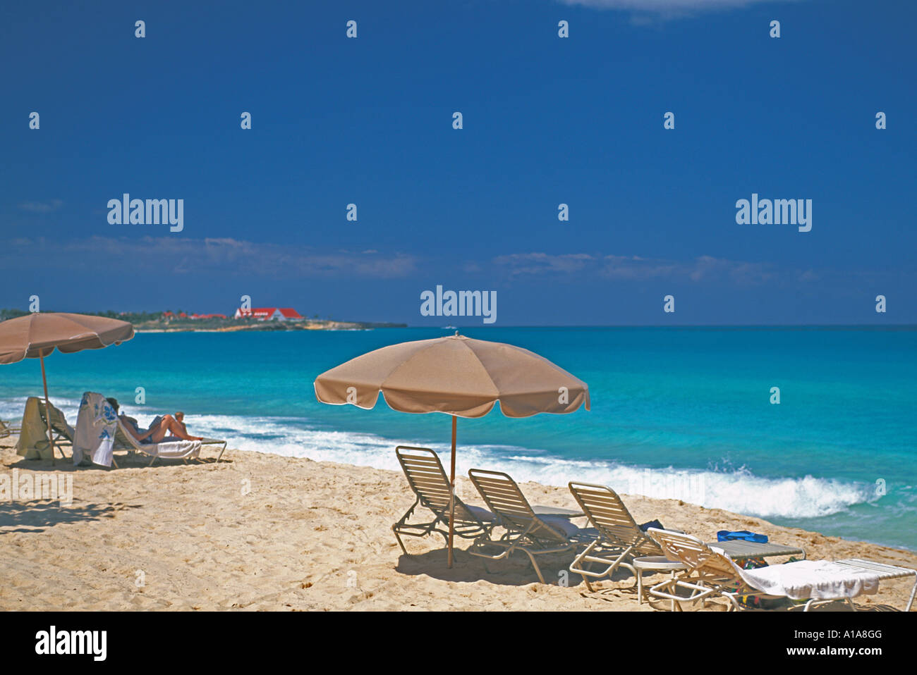 Caribbean Anguilla beach couple chairs beach umbrellas scenic landscape ...
