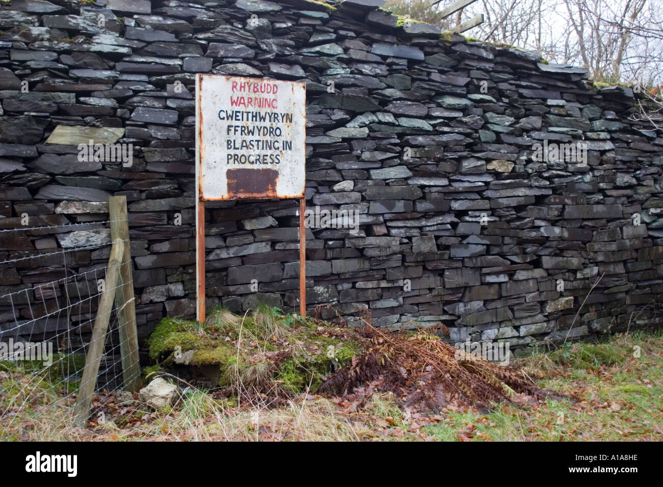 Rusty bilingual Welsh and English warning – blasting in progress sign ...